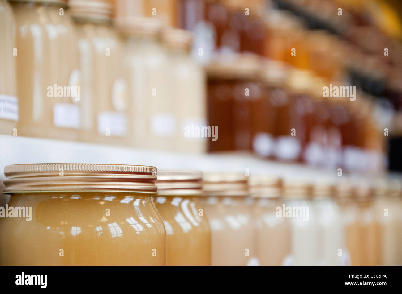 Jars of Honey on display at a honey show Stock Photo - Alamy