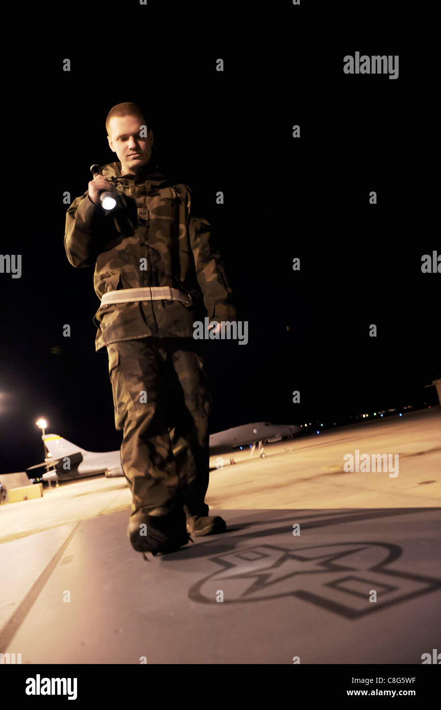 Senior Airman Scott Foust inspects a B-1B Lancer wing for structural ...