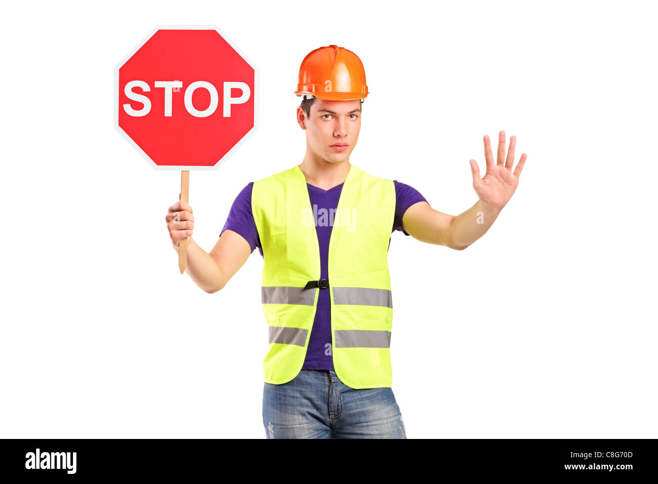 A construction worker holding a traffic sign stop Stock Photo - Alamy