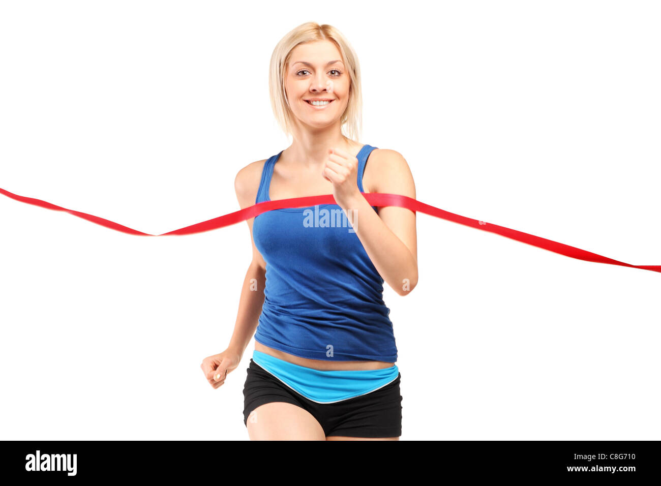 A female runner running towards a finish line Stock Photo - Alamy