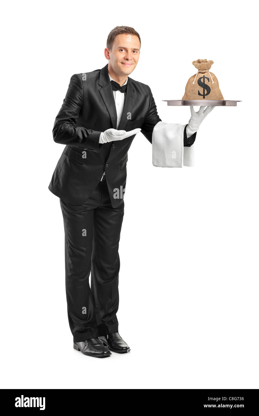 Full length portrait of a butler with bow tie holding a tray with a ...