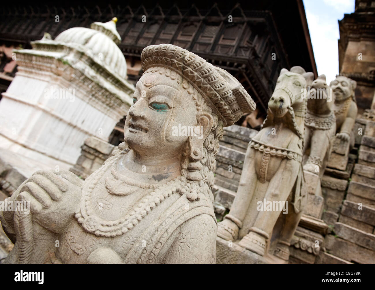 Stone guardians flank the staircase leading up to the Siddhi Lakshmi ...