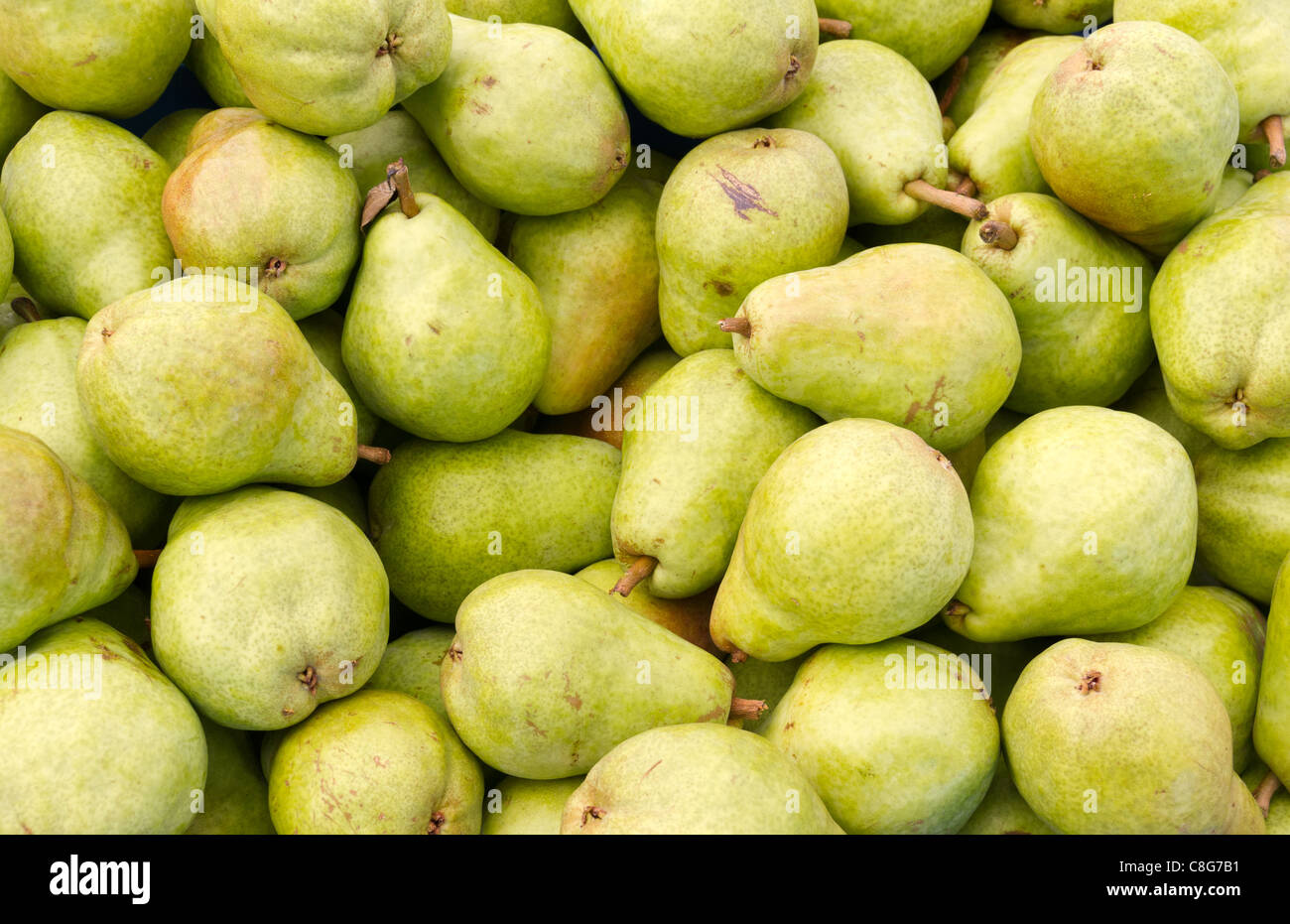 Freshly picked green Bartlett pears on display at the farmer's market ...