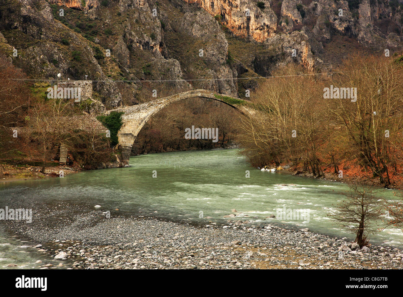The old stone arched bridge of Konitsa, crossing river Aoos, Ioannina ...