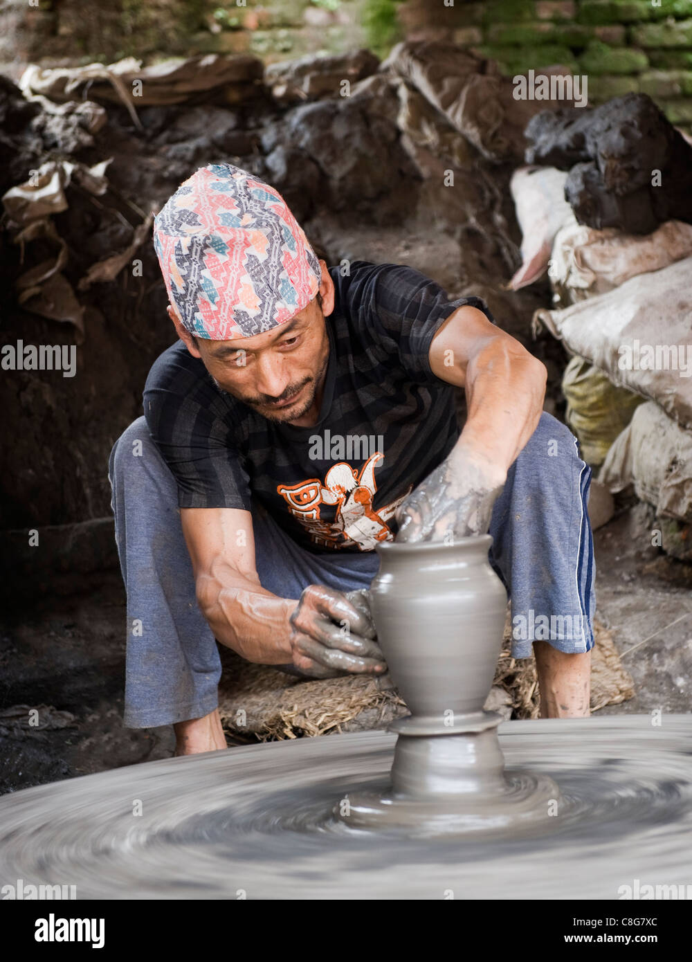 A potter at work in Potter Square, Bhaktapur near Kathmandu, Nepal ...
