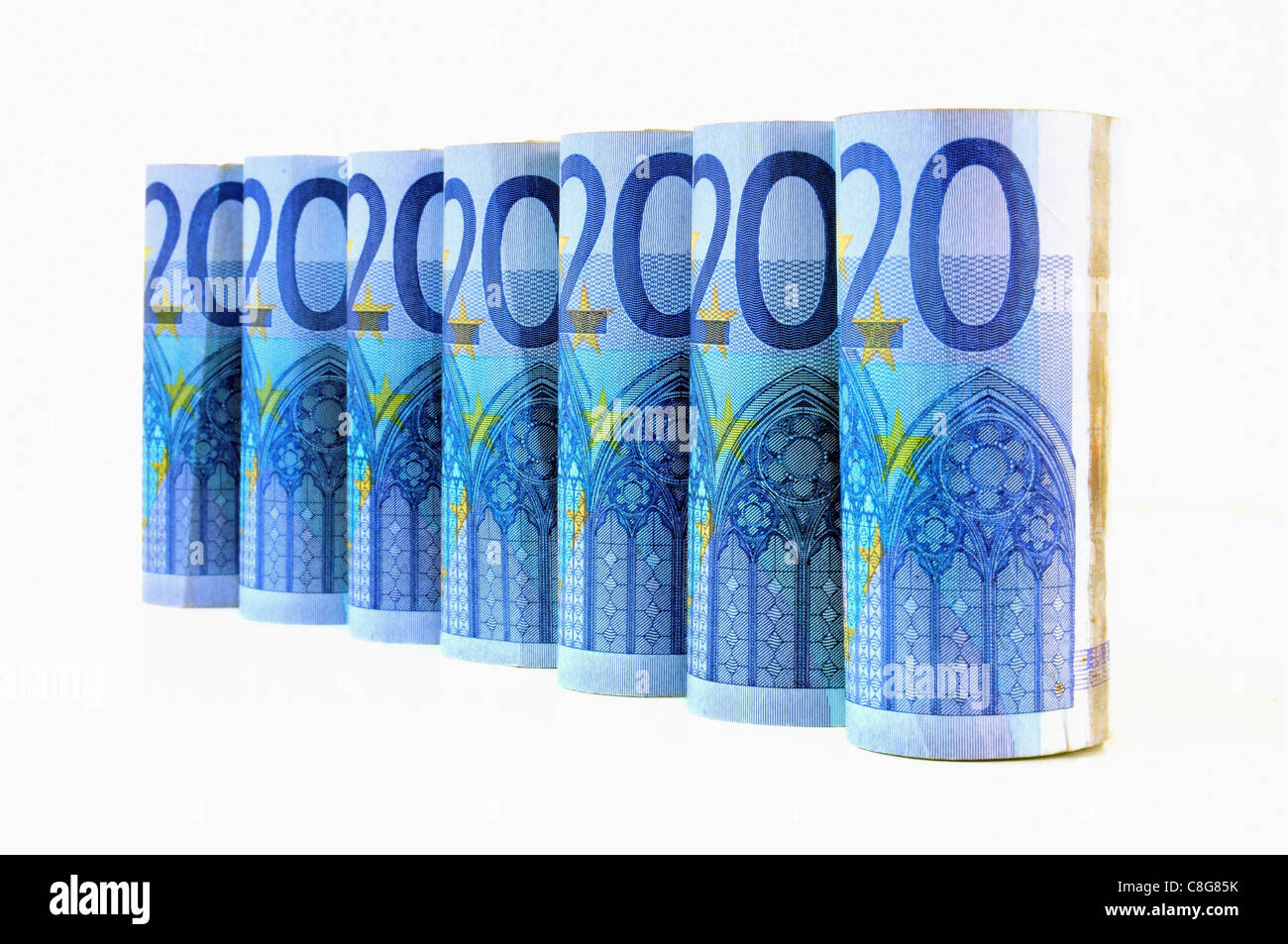 Rolled up 20 Euro banknotes on white background Stock Photo - Alamy