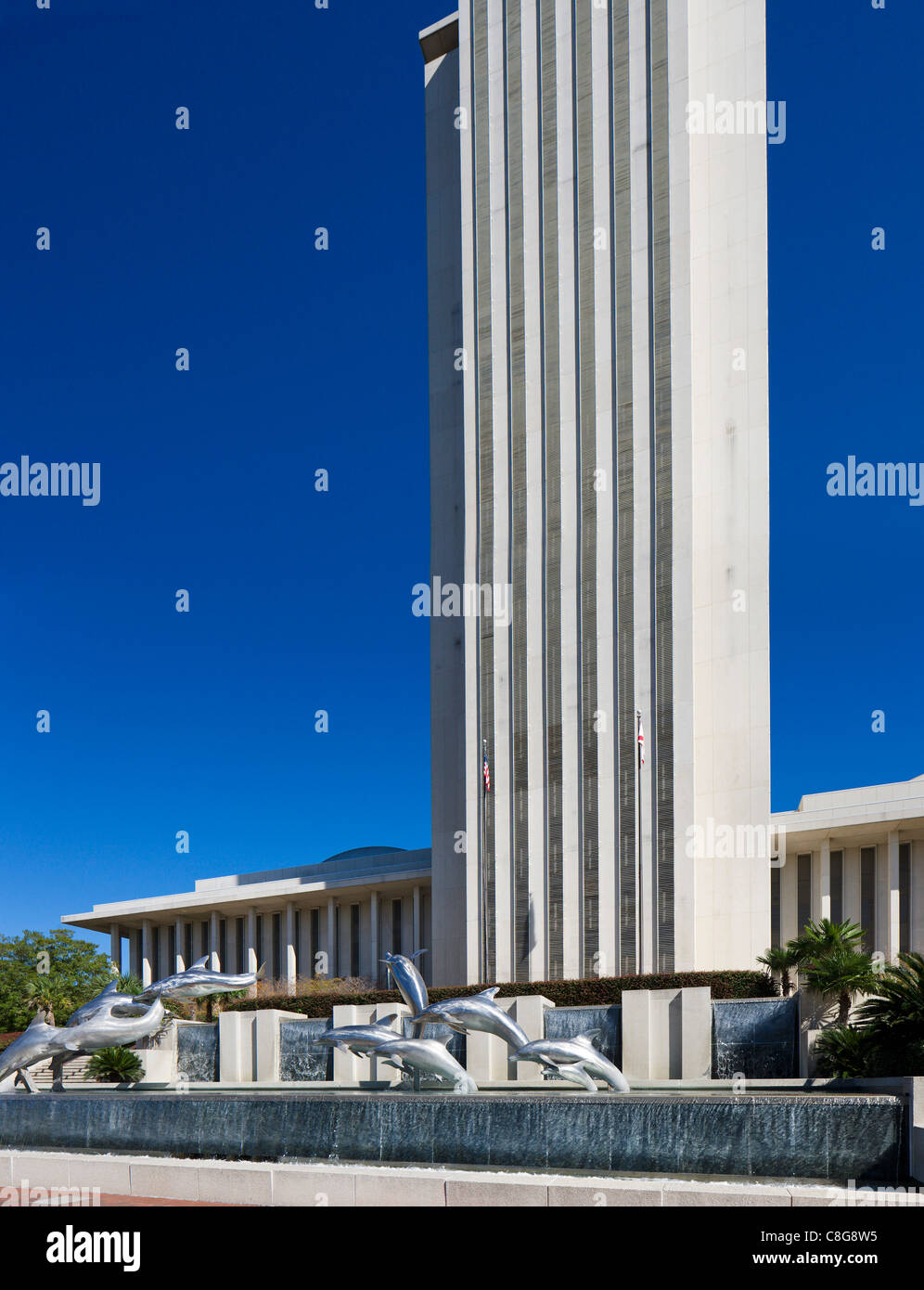 The modern State Capitol Building with dolphin sculpture in the ...