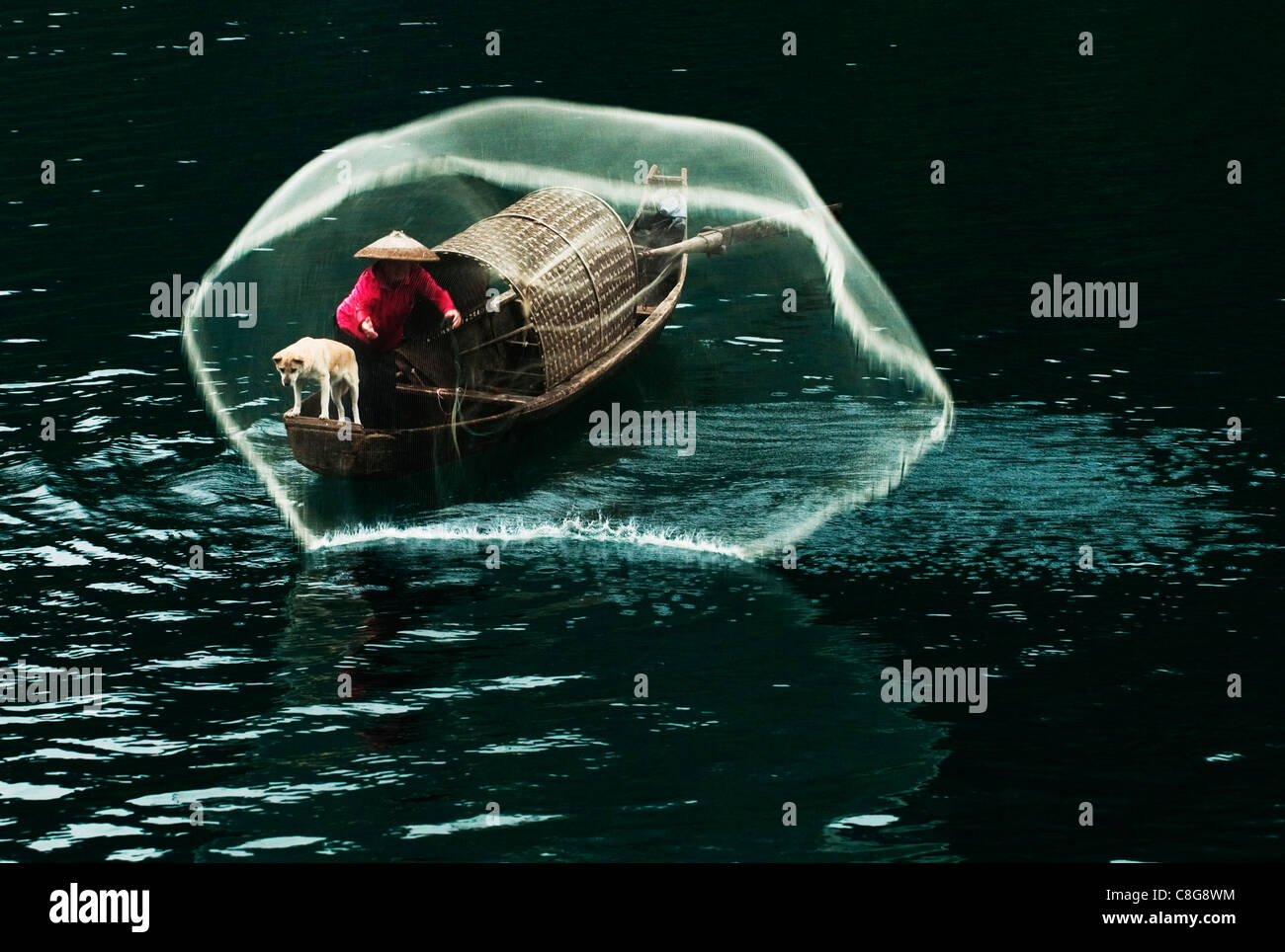 Fisherman Casting a Fishing Net Stock Photo - Alamy