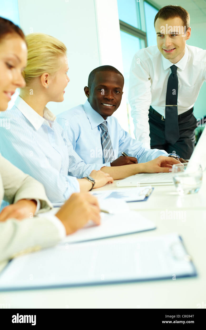 Office workers working together in office Stock Photo - Alamy