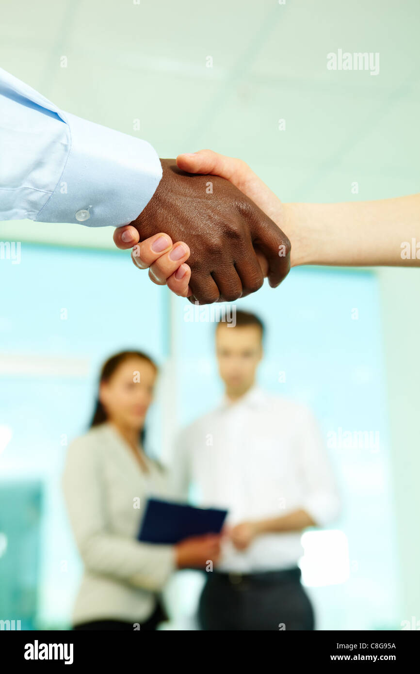 Shaking hands in office after conclusion of treaty Stock Photo - Alamy