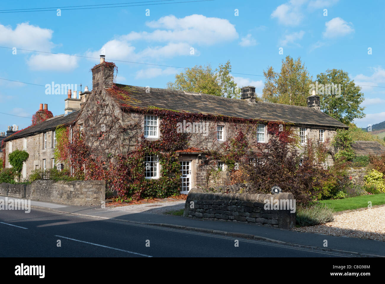 Typical Peak District stone cottages in the Derbyshire village of ...