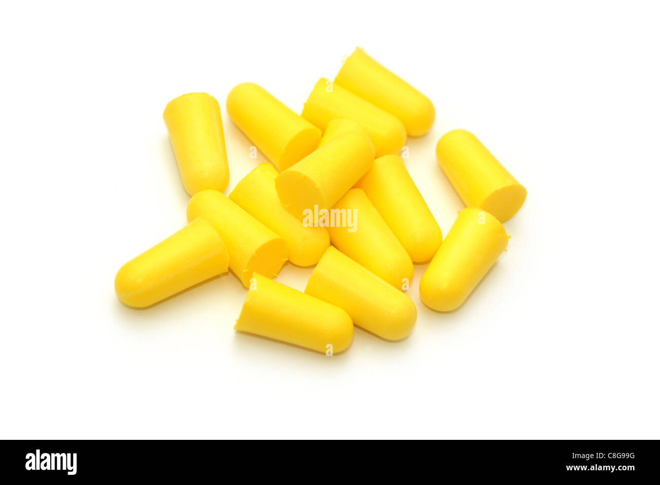 Group of yellow ear plugs isolated on white Stock Photo - Alamy