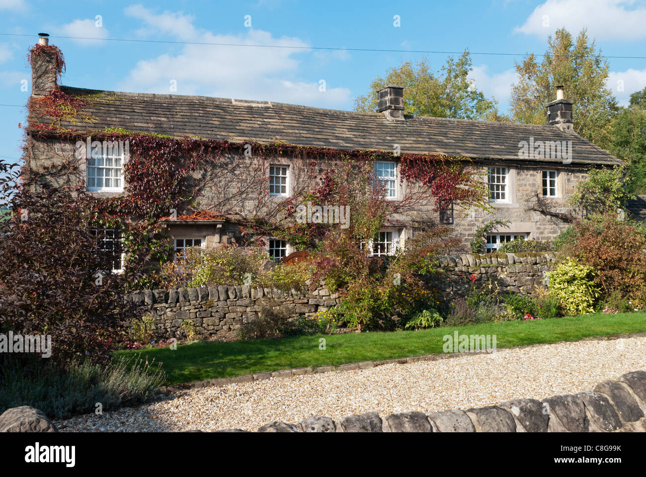 Typical Peak District stone cottages in the Derbyshire village of ...