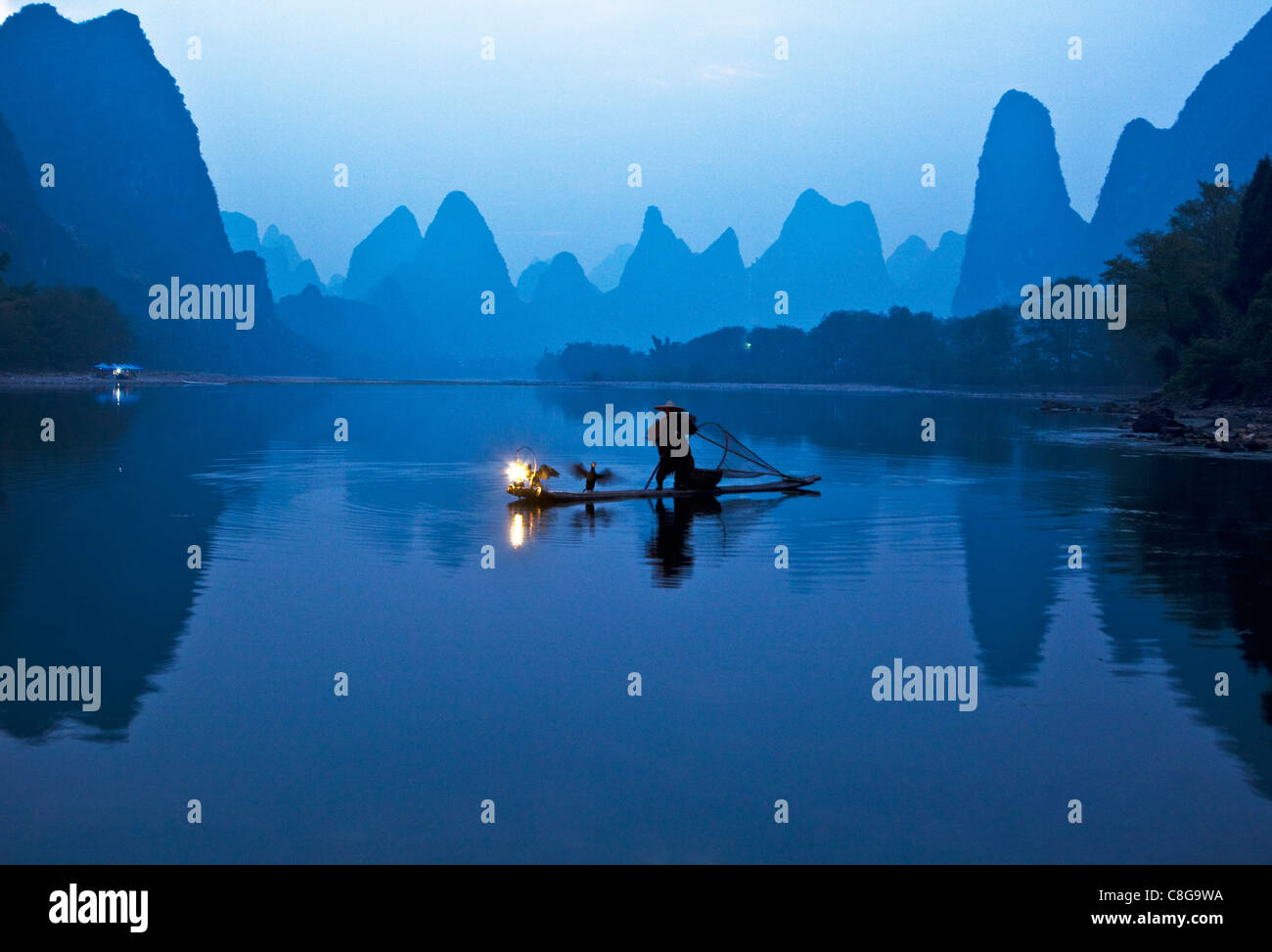 Fisherman on Li River at Dawn Stock Photo - Alamy