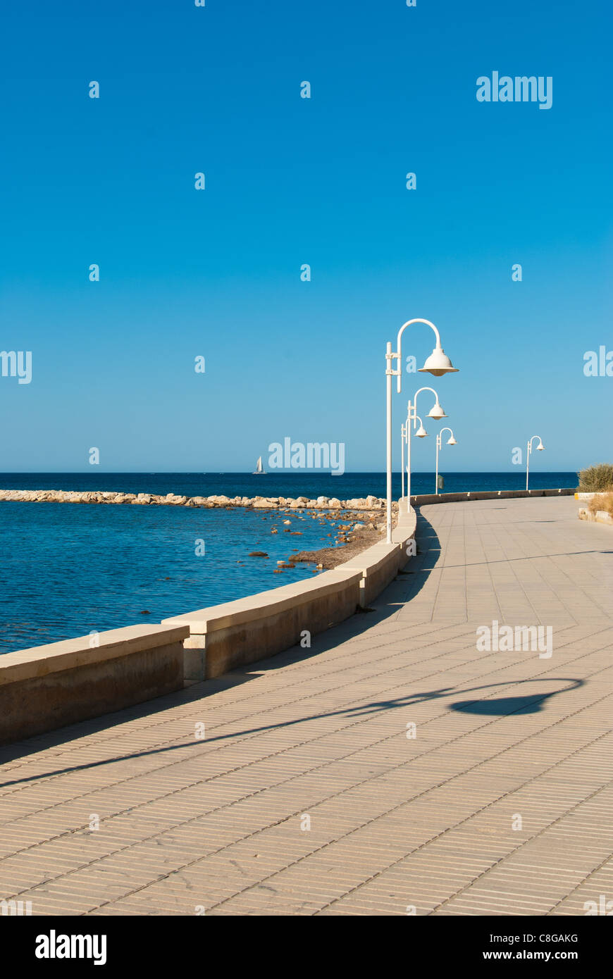 Idyllic Mediterranean beach promenade on a sunny afternoon Stock Photo ...