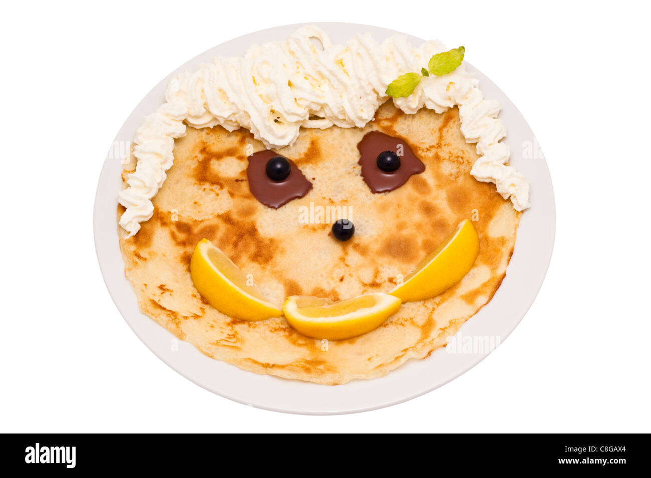 Happy face made up from crepe, lemons, blueberries, chocolate, mint and ...