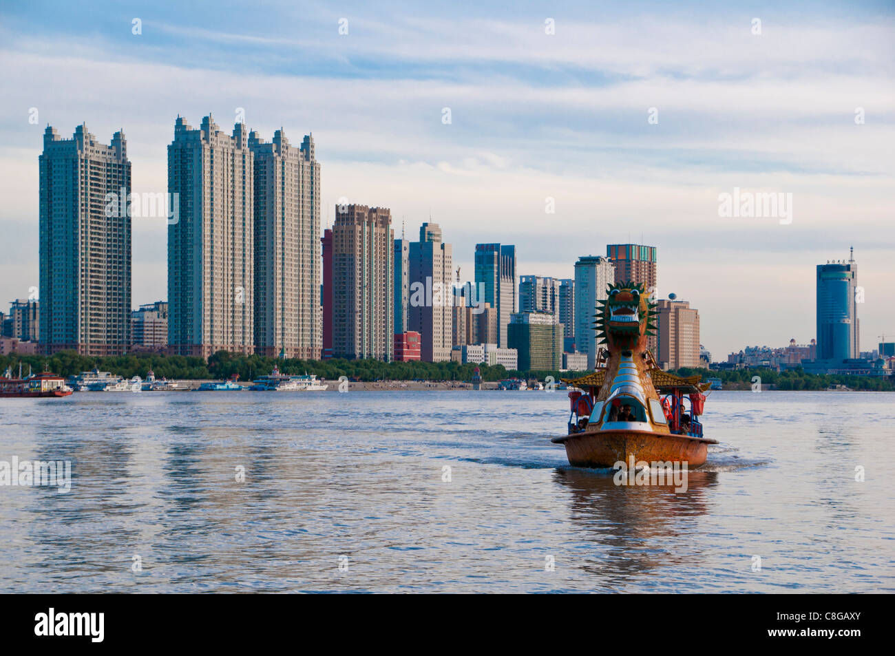 The Songhua River in front of modern office blocks in the most northern ...