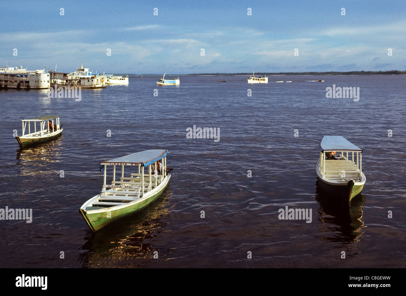 Manaus, Brazil. Small river boat water taxis moored with large gaiola ...