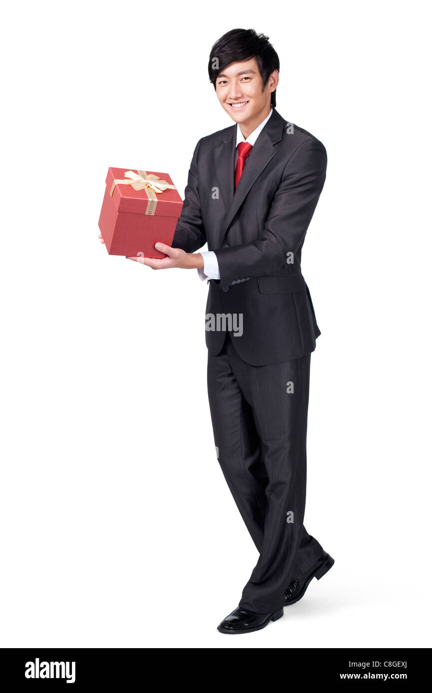 Happy Businessman Holding a Gift Stock Photo - Alamy