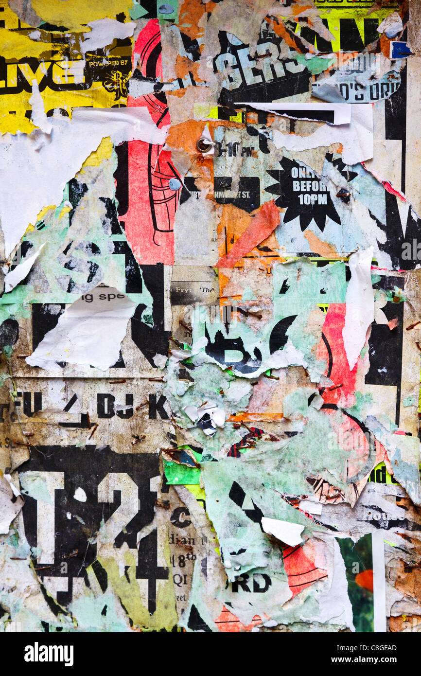 Photo of a billboard with lots of old ripped posters. Good background ...