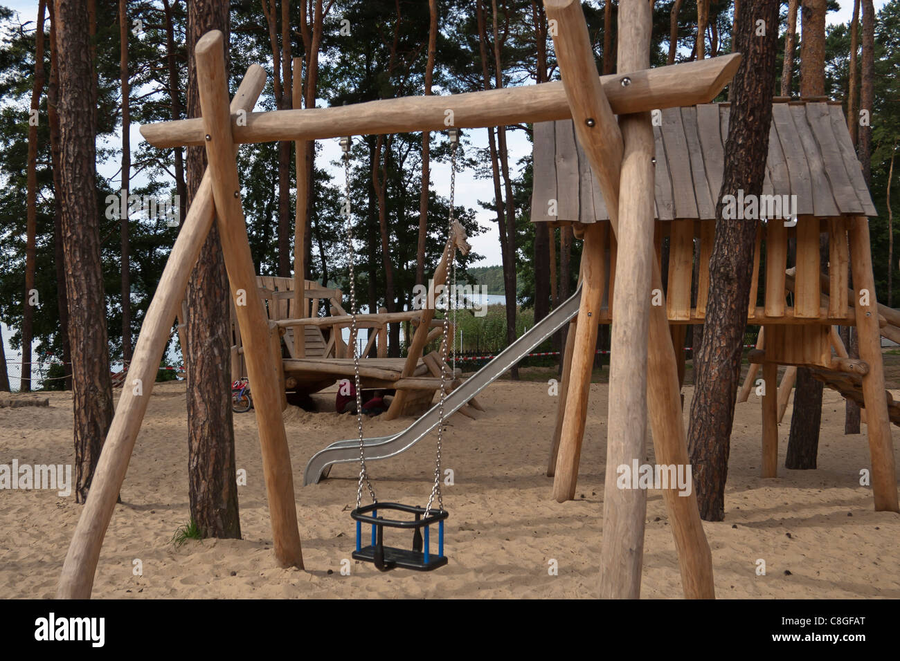 Natural wooden playground for children in the forest Stock Photo - Alamy