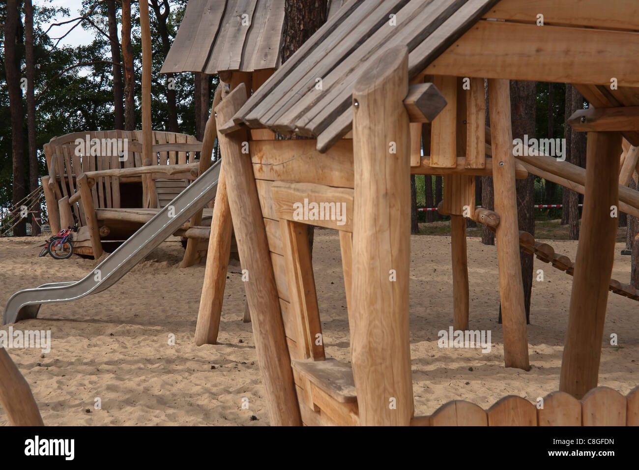 Natural wooden playground for children in the forest Stock Photo - Alamy