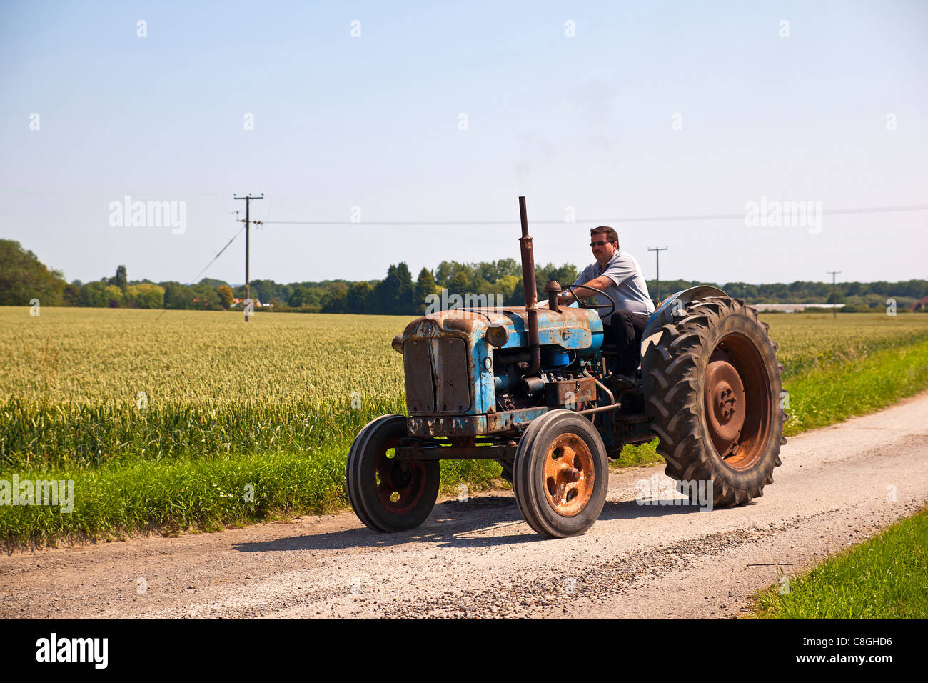 Blue vintage working tractor hi-res stock photography and images - Alamy