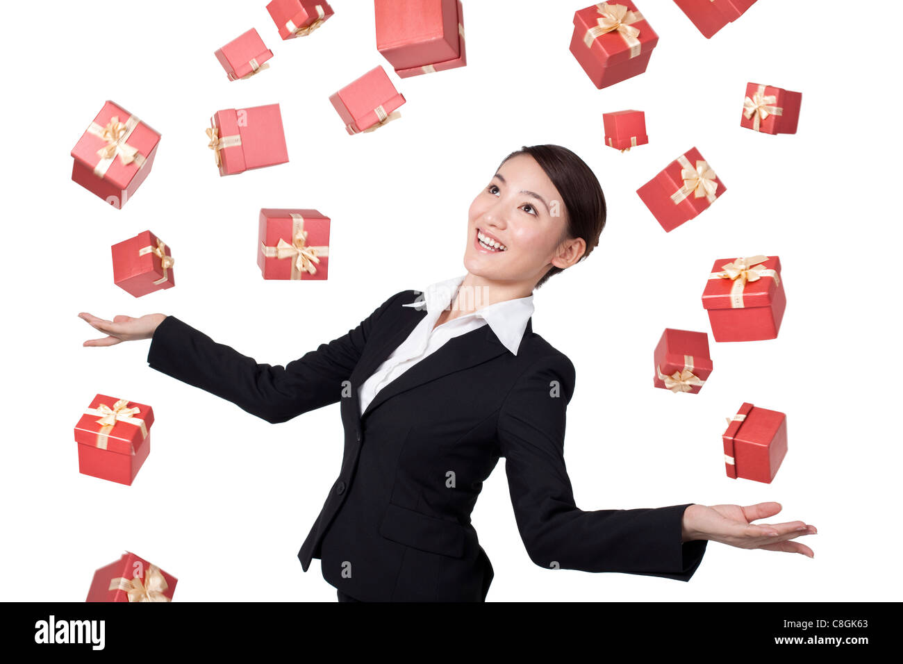 Excited Businesswoman with gift boxes Stock Photo - Alamy
