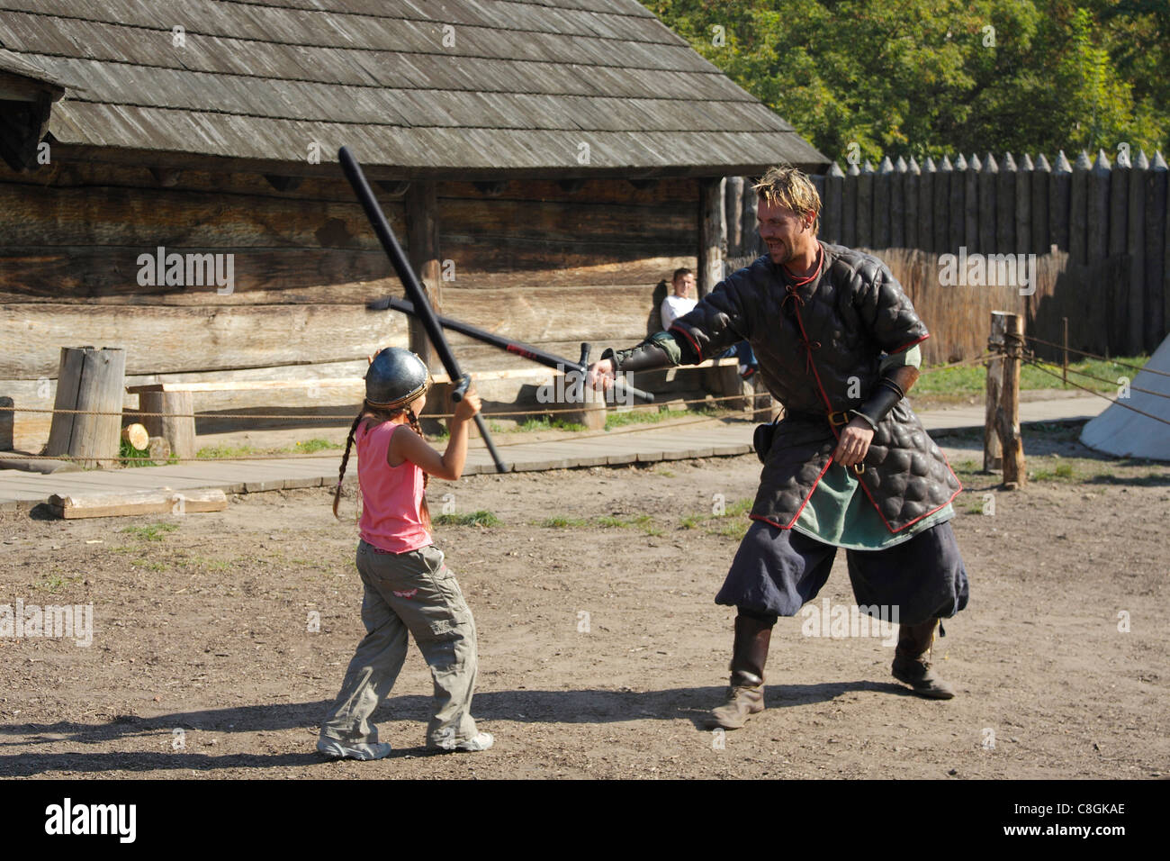 People Fighting In War With Swords