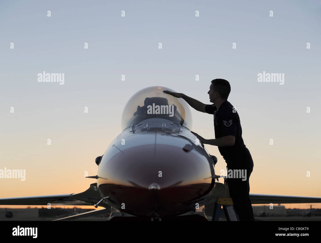 Staff Sgt. Zachary French wipes down his jet's canopy during post ...