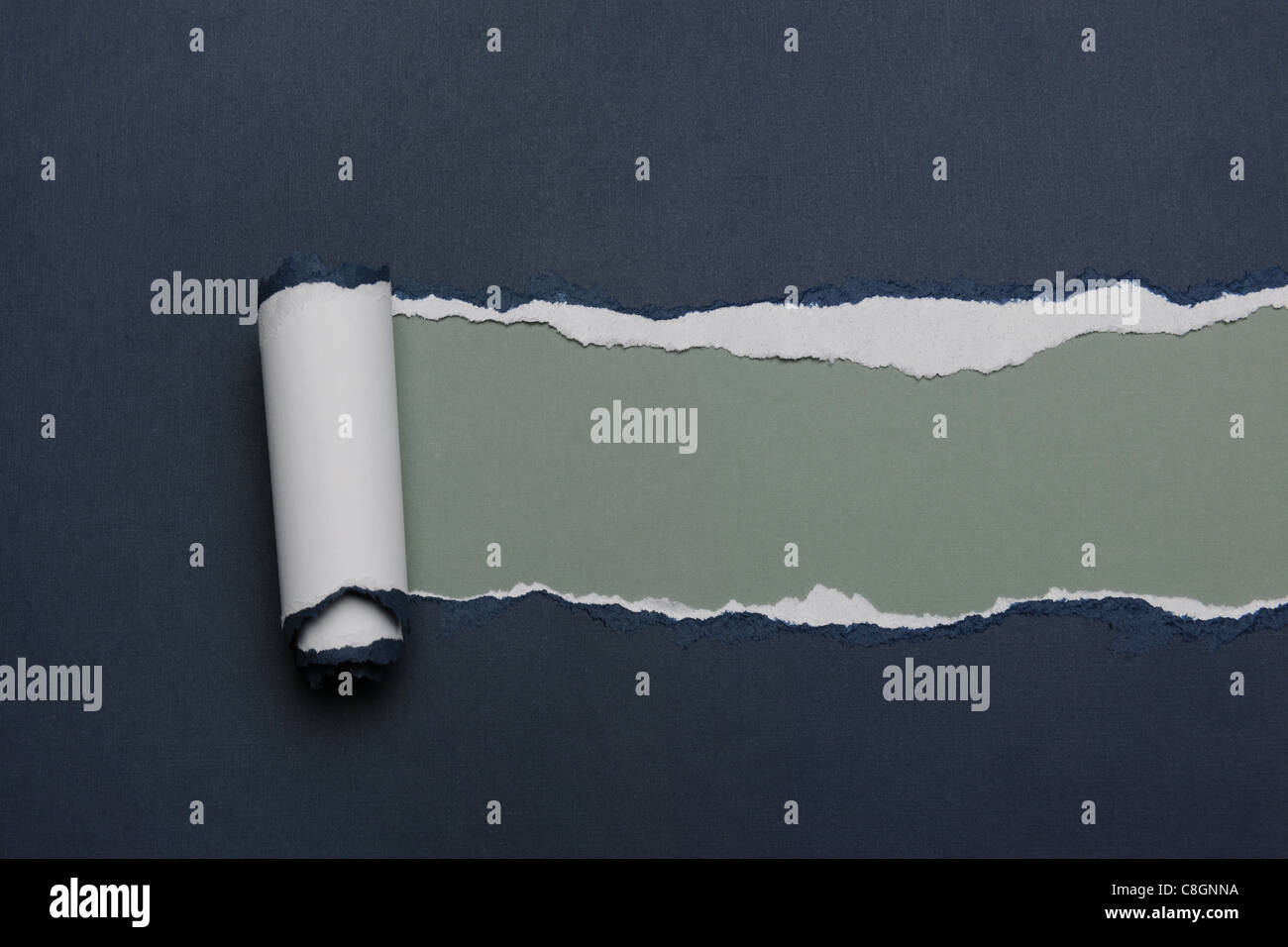 Rip Blue Paper and green background with space for text Stock Photo - Alamy