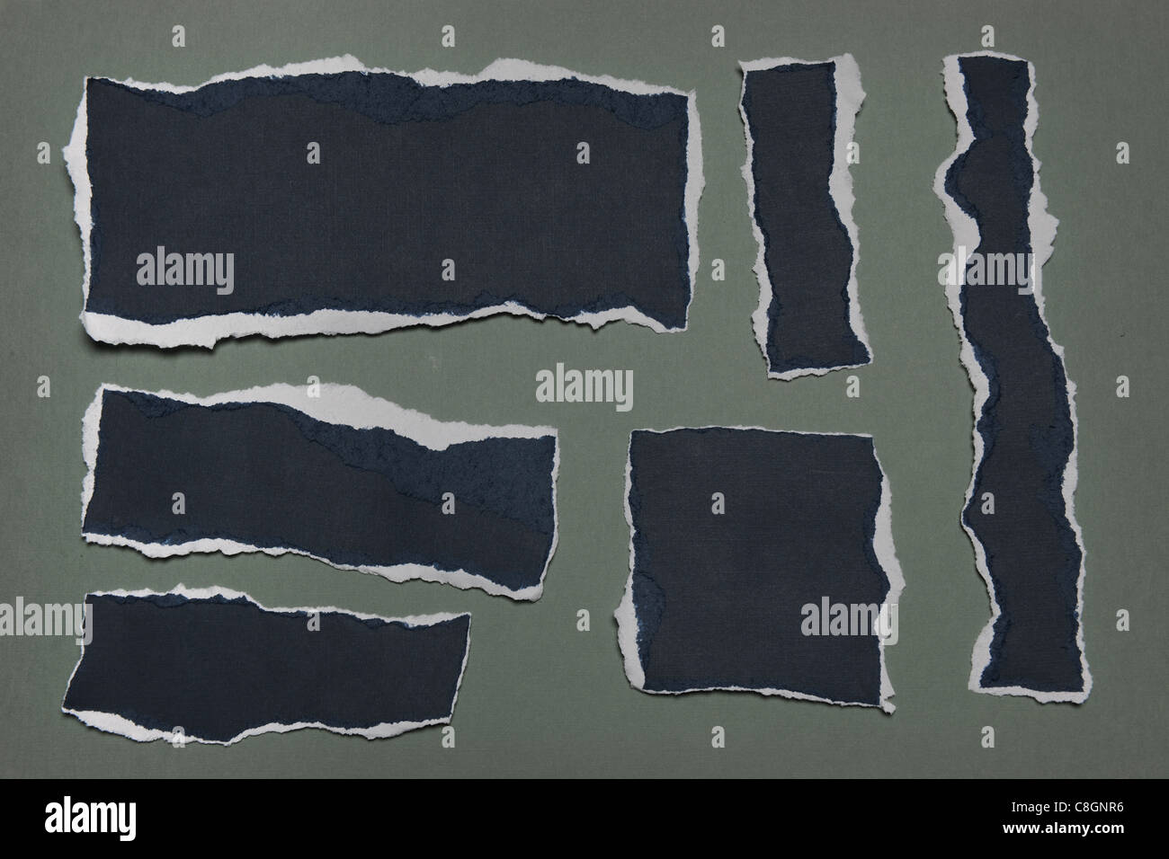 Piece of Rip Paper with white edges against a green background Stock ...