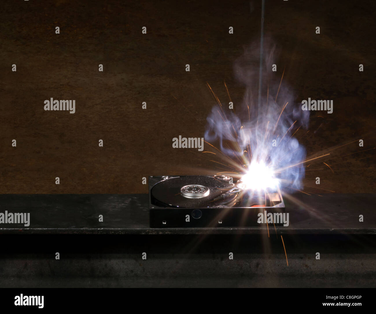 welding scenery with hard disk drive, welding mask detail and flying ...