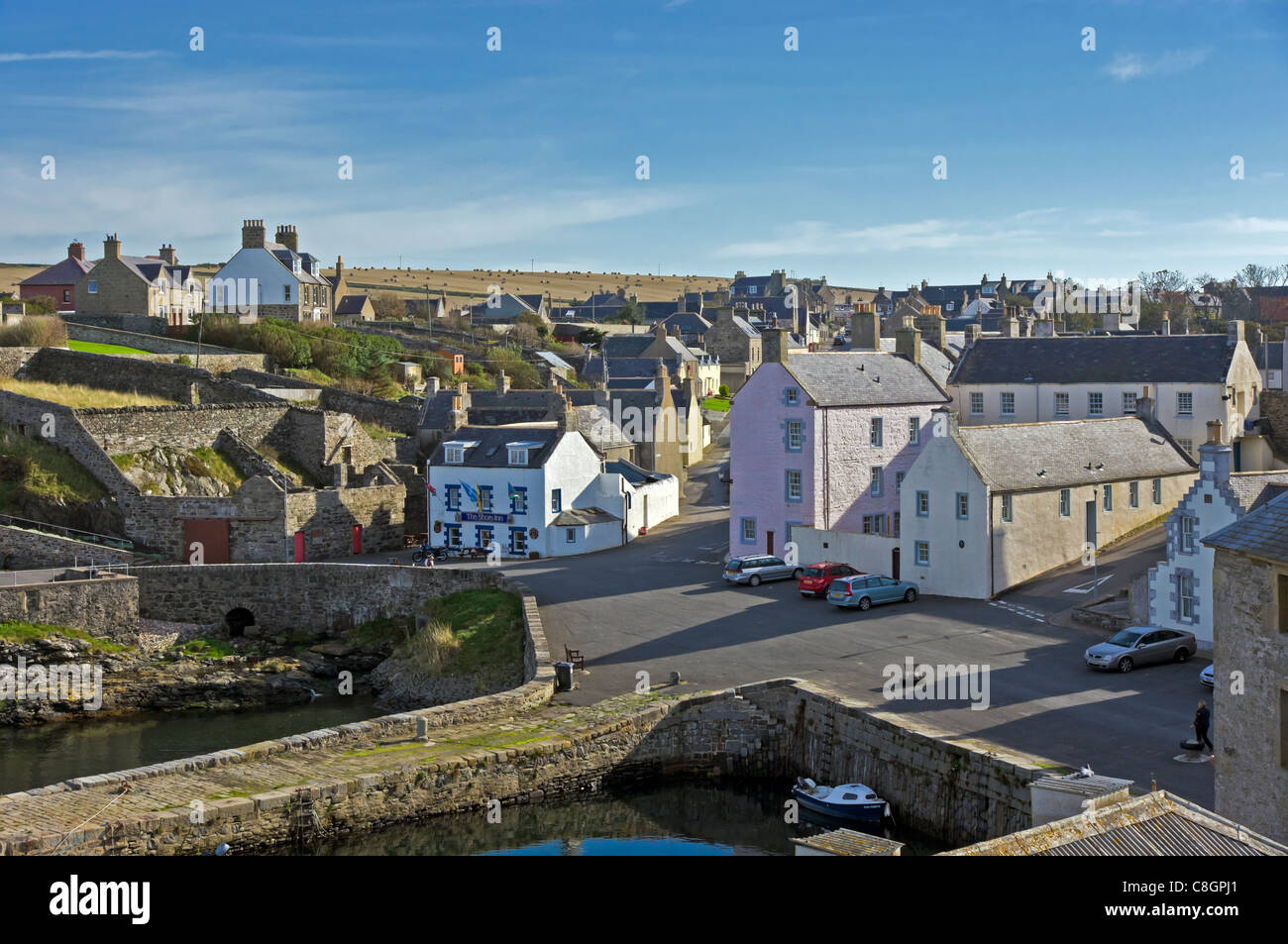 View across the old harbour in Portsoy Scotland towards the Shore Inn ...