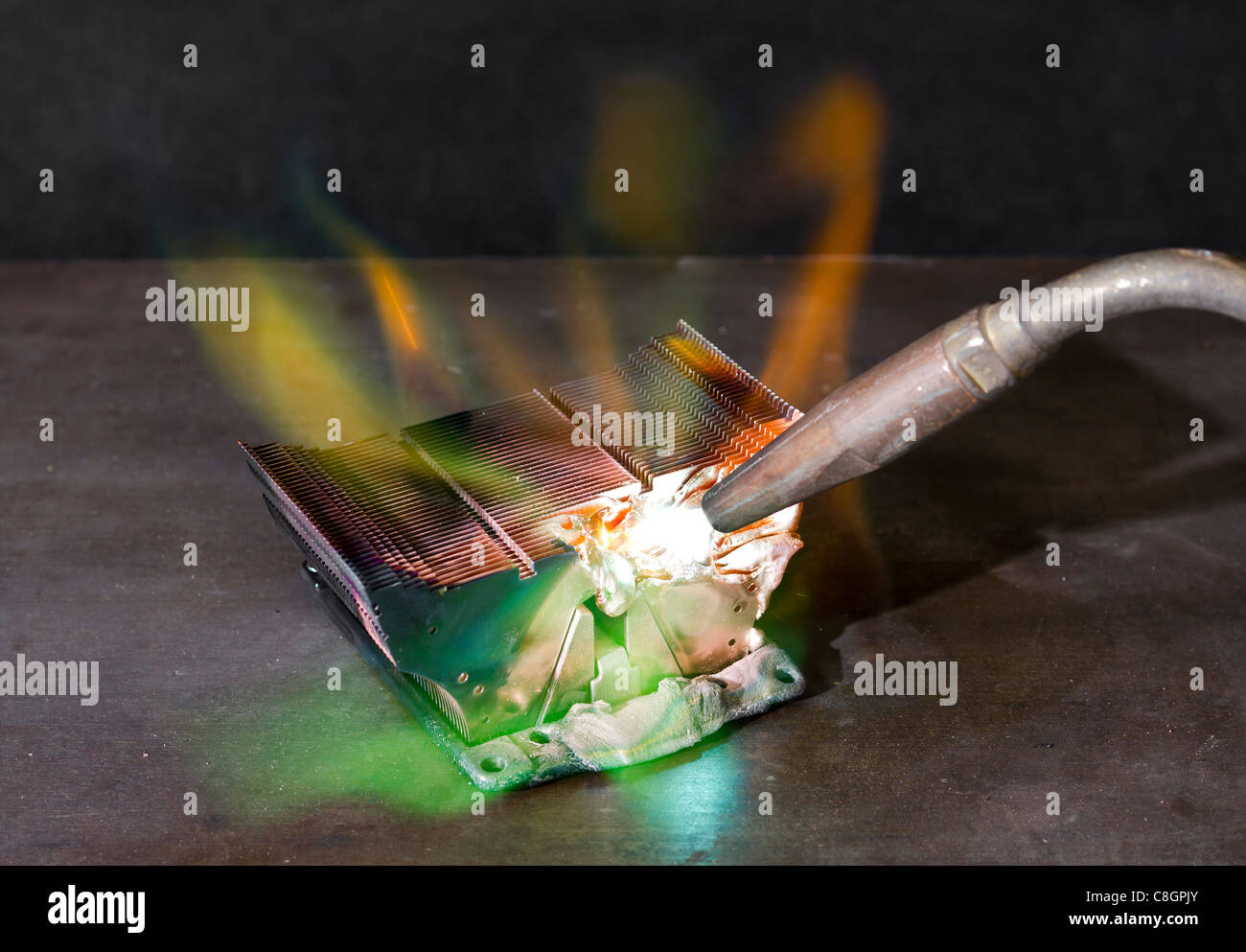 melting heat sink and welding torch on metallic ground Stock Photo - Alamy