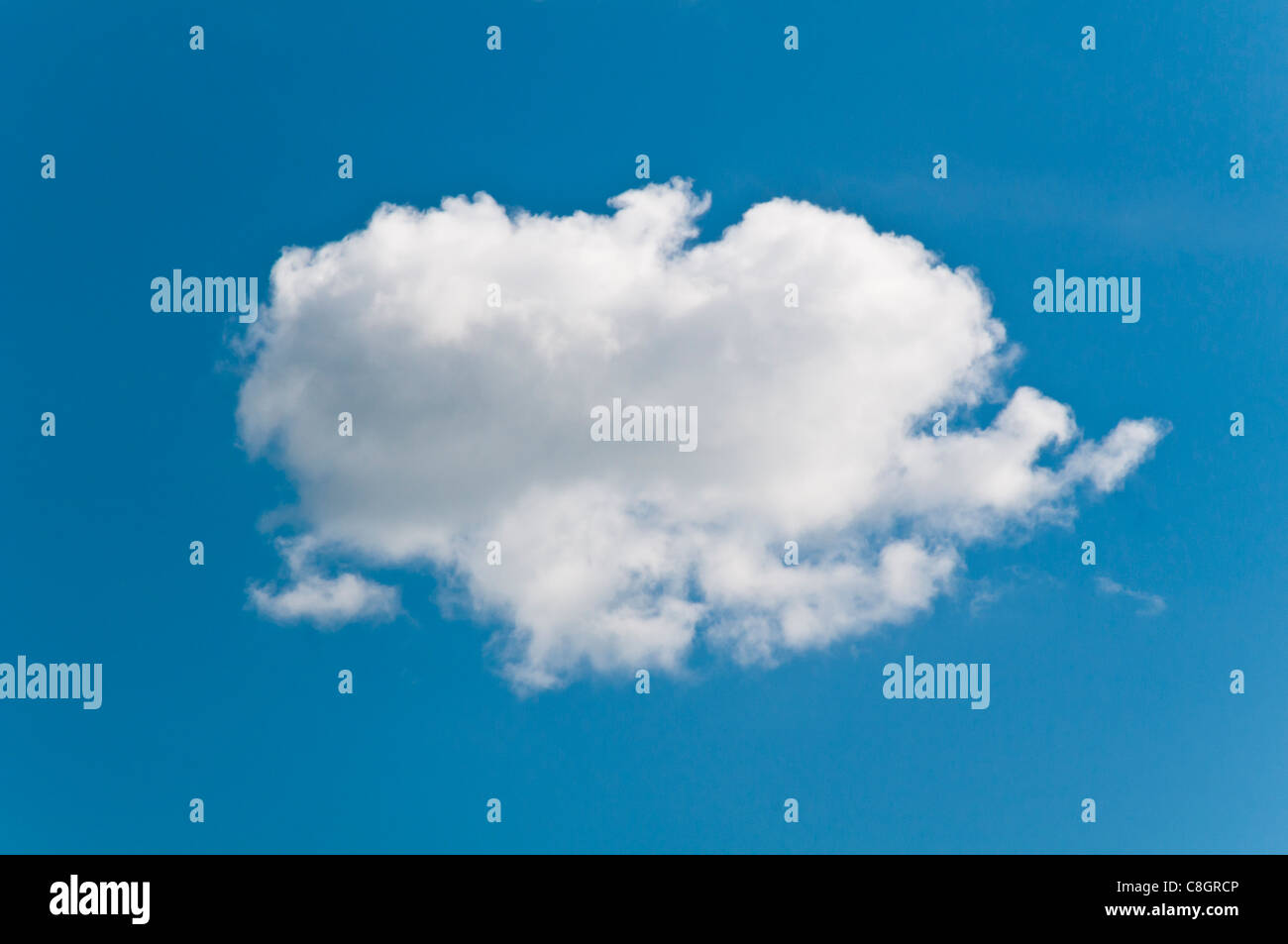 Blue daytime sky with one white cloud Stock Photo - Alamy