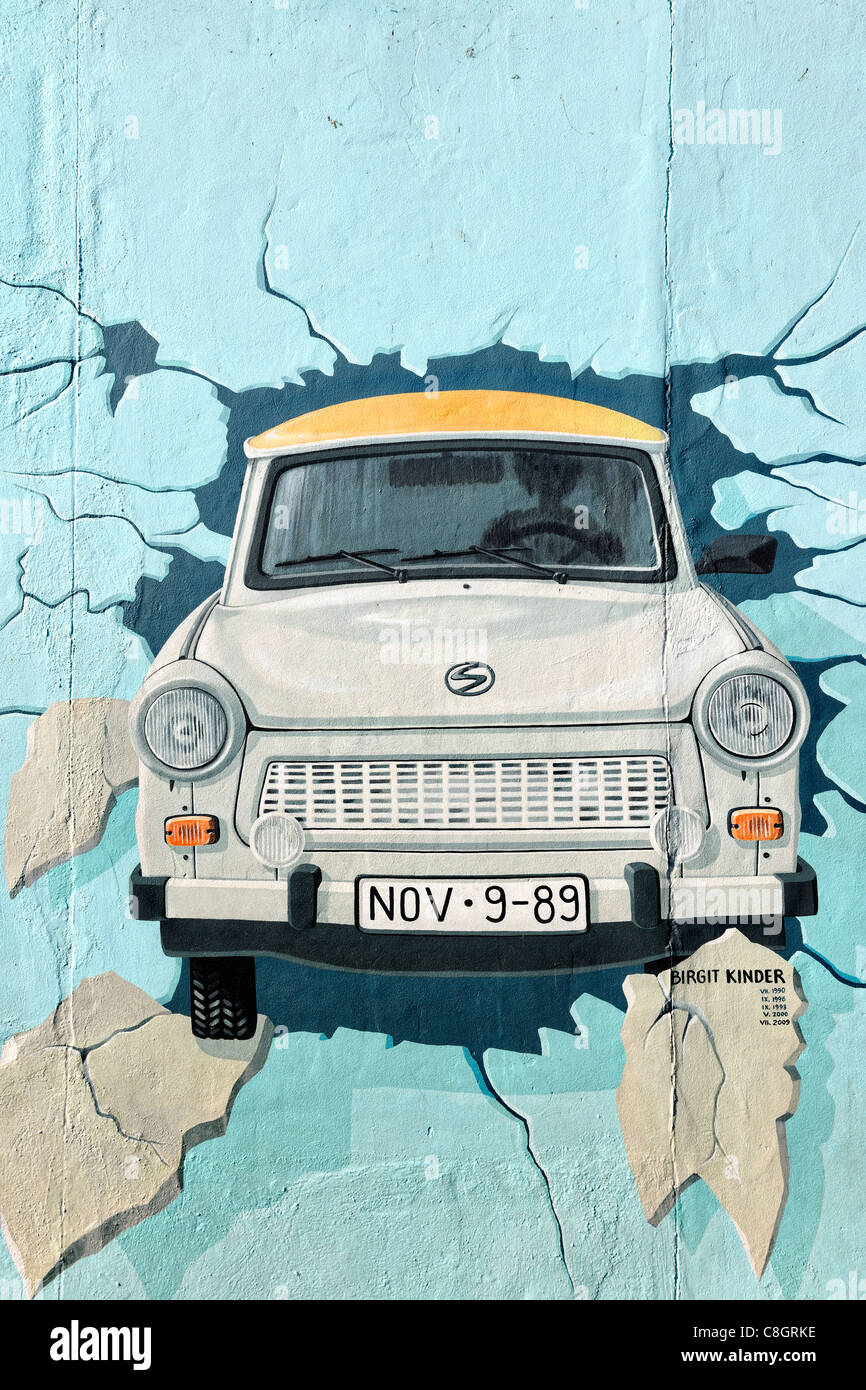 Mural of Trabant car breaking through Berlin Wall at East Side Gallery ...