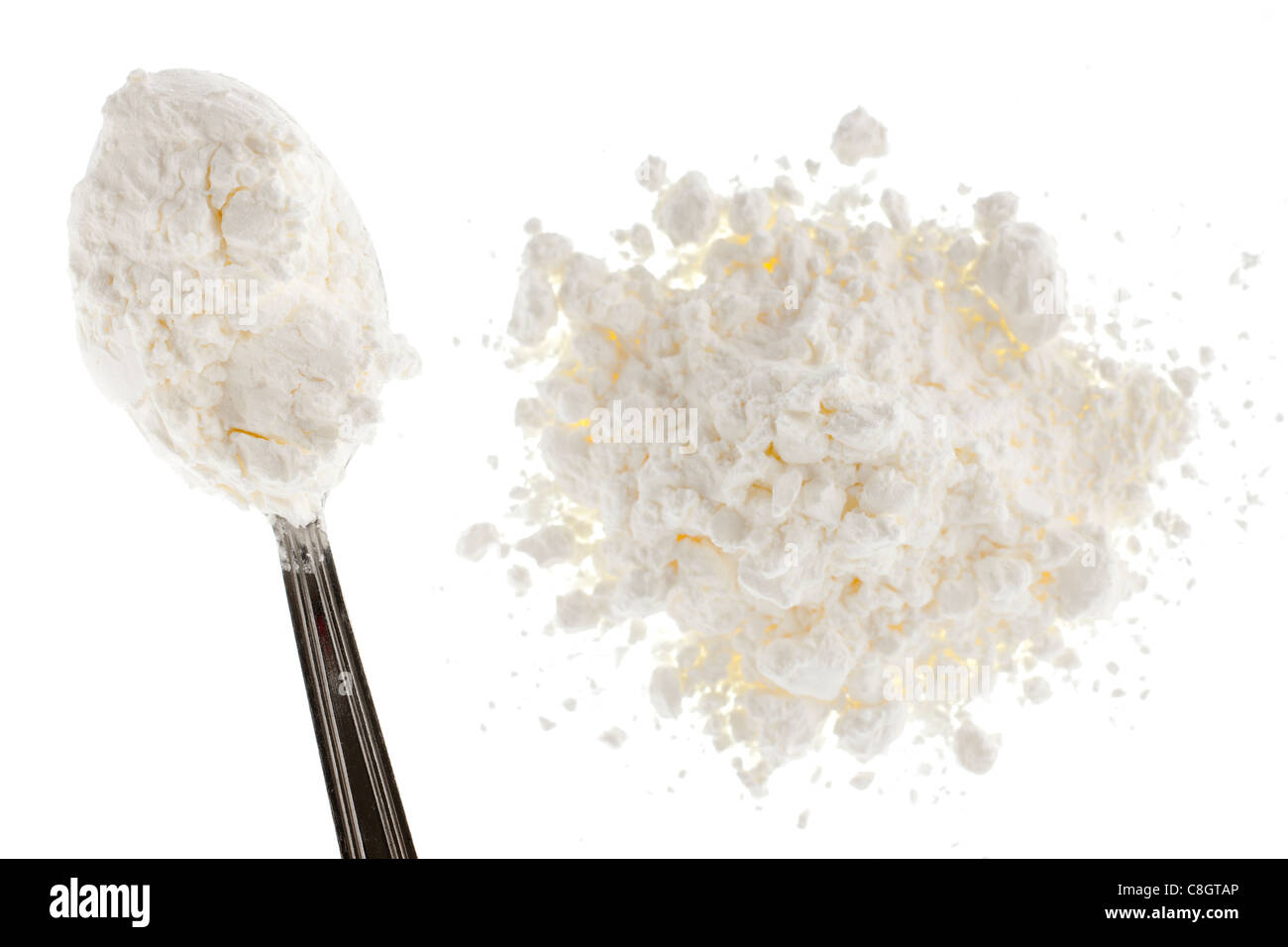 Pile and spoonful of Cornflour Stock Photo - Alamy