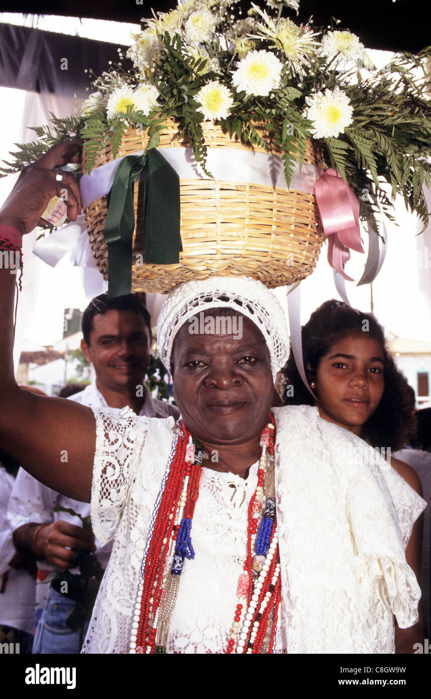 Salvador, Bahia, Brazil. Candomble follower in traditional white lace ...