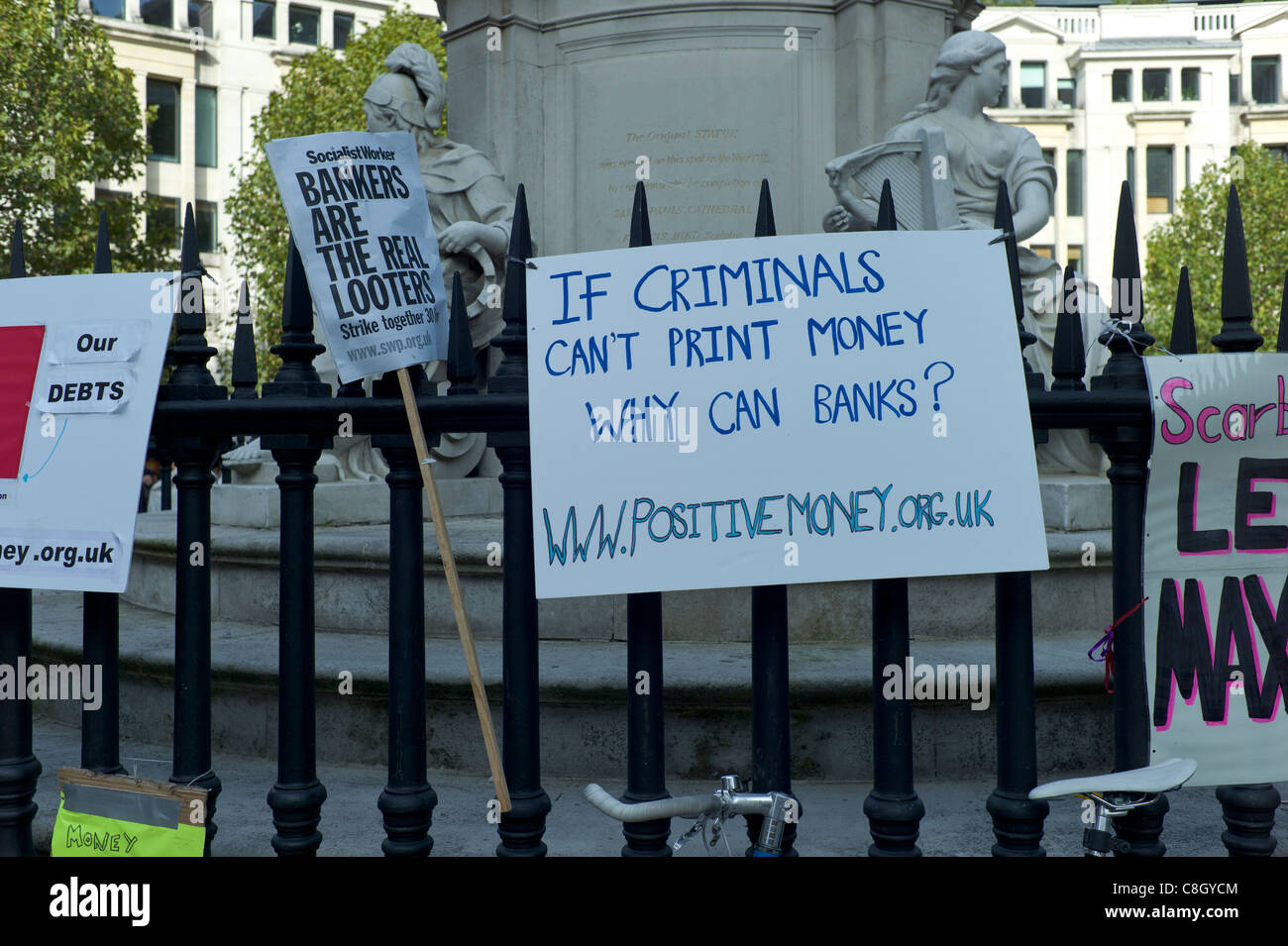 Placards with slogans and banners at the anti Capitalist protest St ...