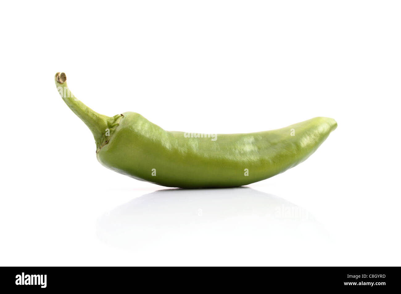 Single green chili isolated on a white background, with a reflection ...