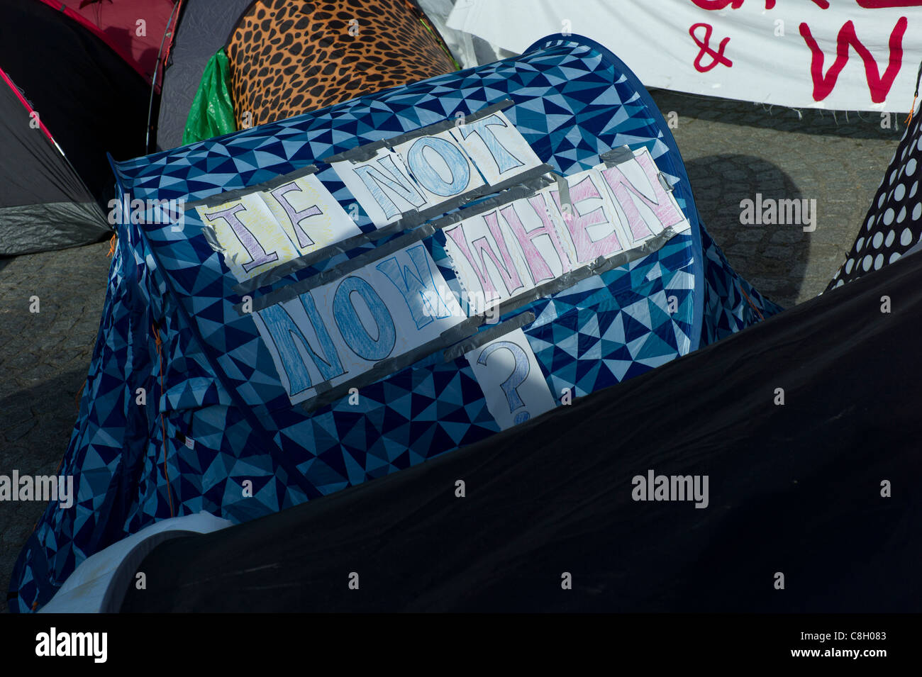Tents with slogans and banners at the anti Capitalist protest St.Paul's ...