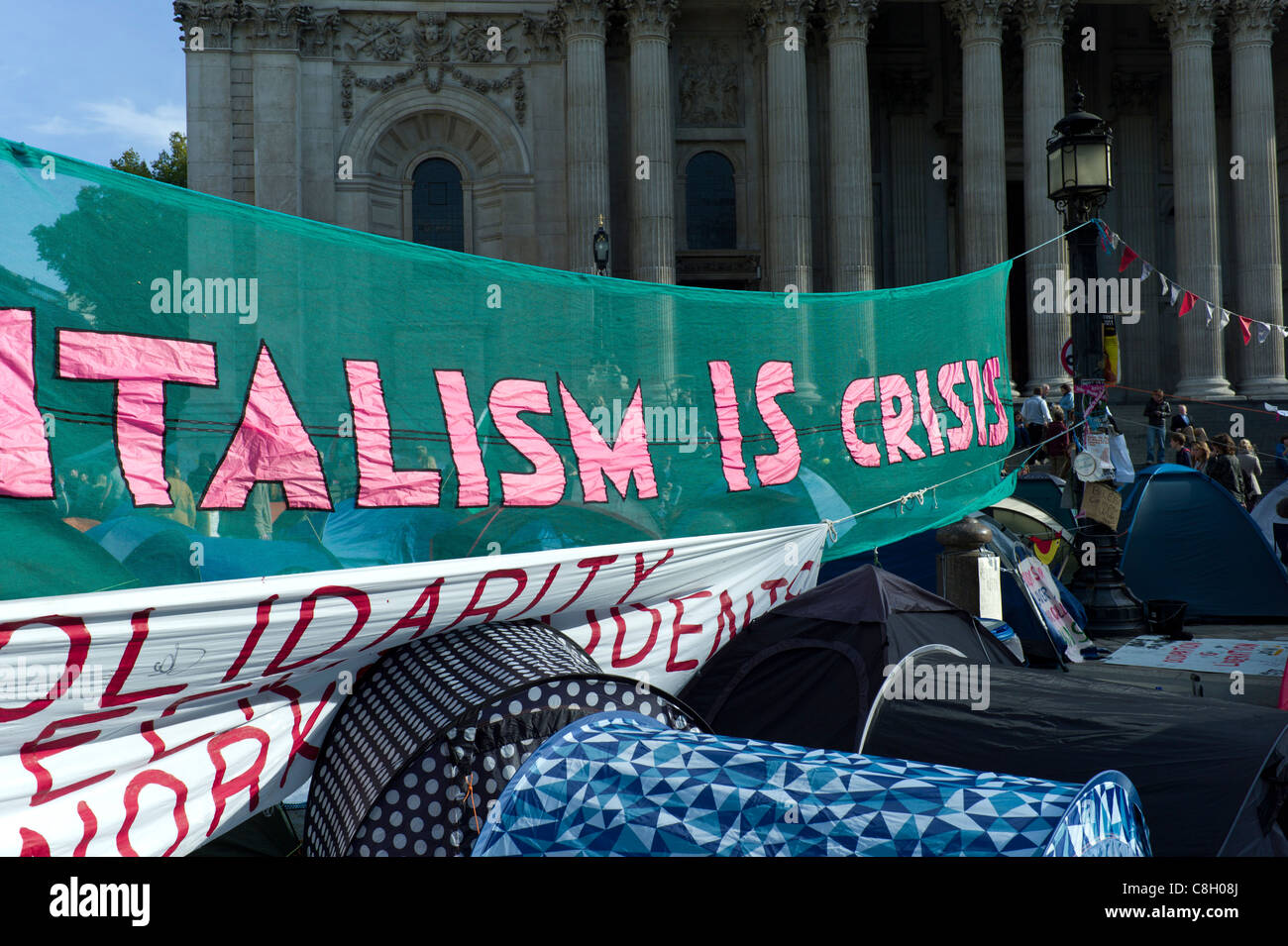 Tents with slogans, posters and banners at the anti Capitalist protest ...
