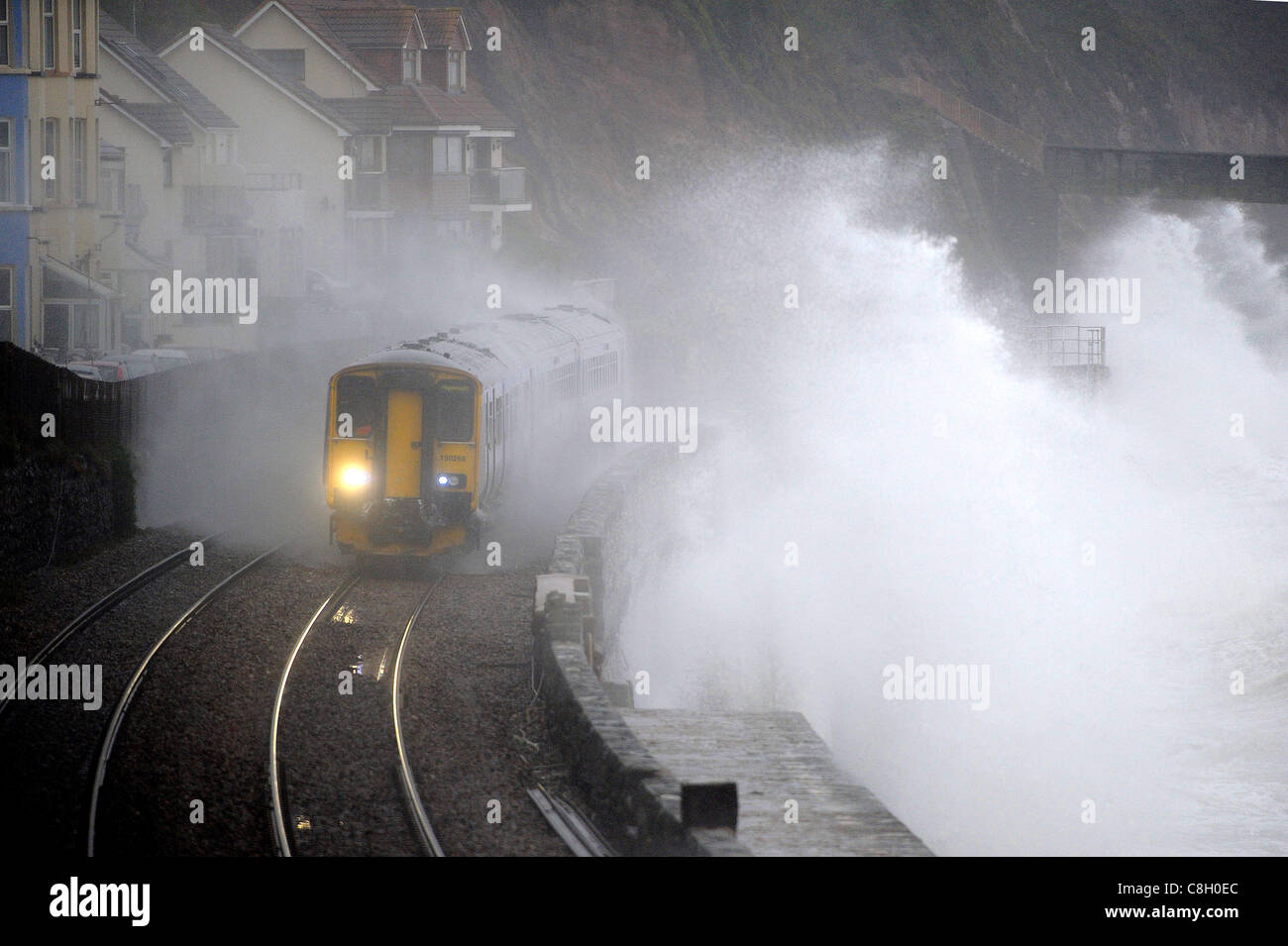 A train is battered by waves at Dawlish in Devon as storms hit the ...