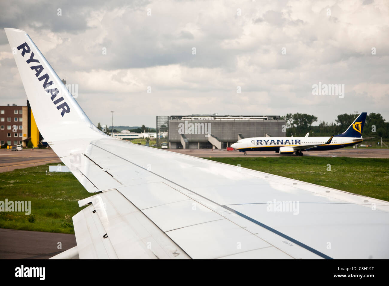 Two Ryanair jets pass eachother at Gatwick airport UK Stock Photo - Alamy