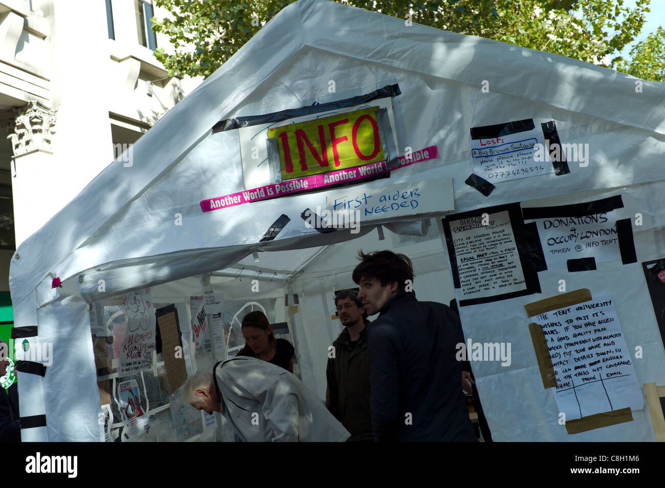 Tents with slogans and banners at the anti Capitalist protest St.Paul's ...
