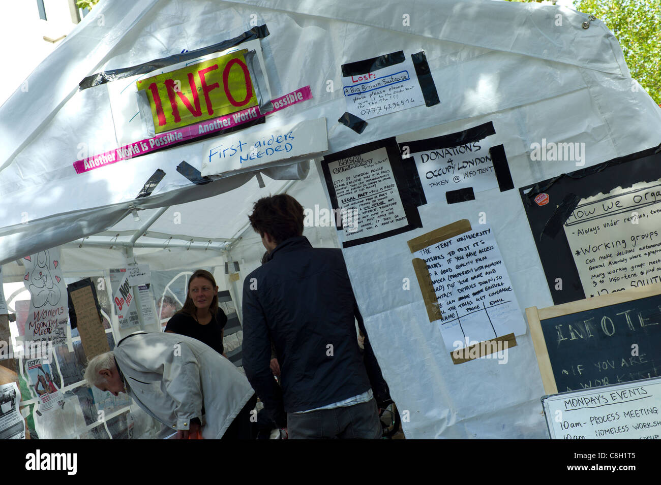 Tents with slogans and banners at the anti Capitalist protest St.Paul's ...