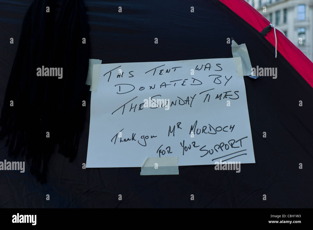Tents with slogans, posters and banners at the anti Capitalist protest ...