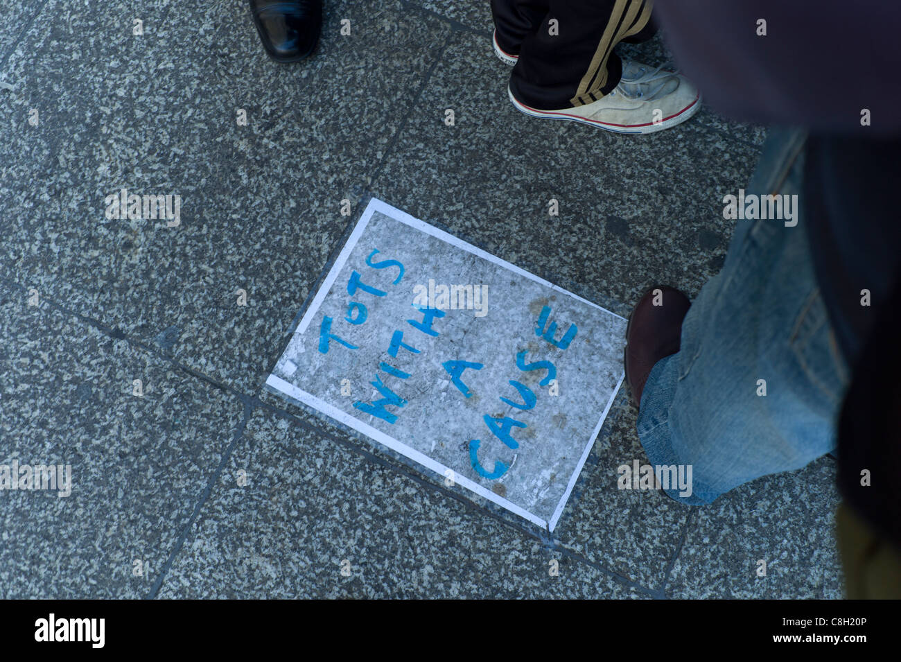 Protesters legs with slogans and banners at the anti Capitalist protest ...