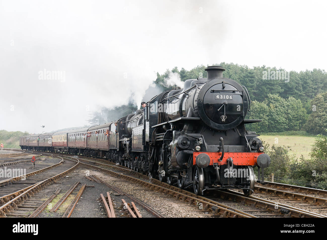 Steam locomotive pulling a passenger train on the North Norfolk Railway ...